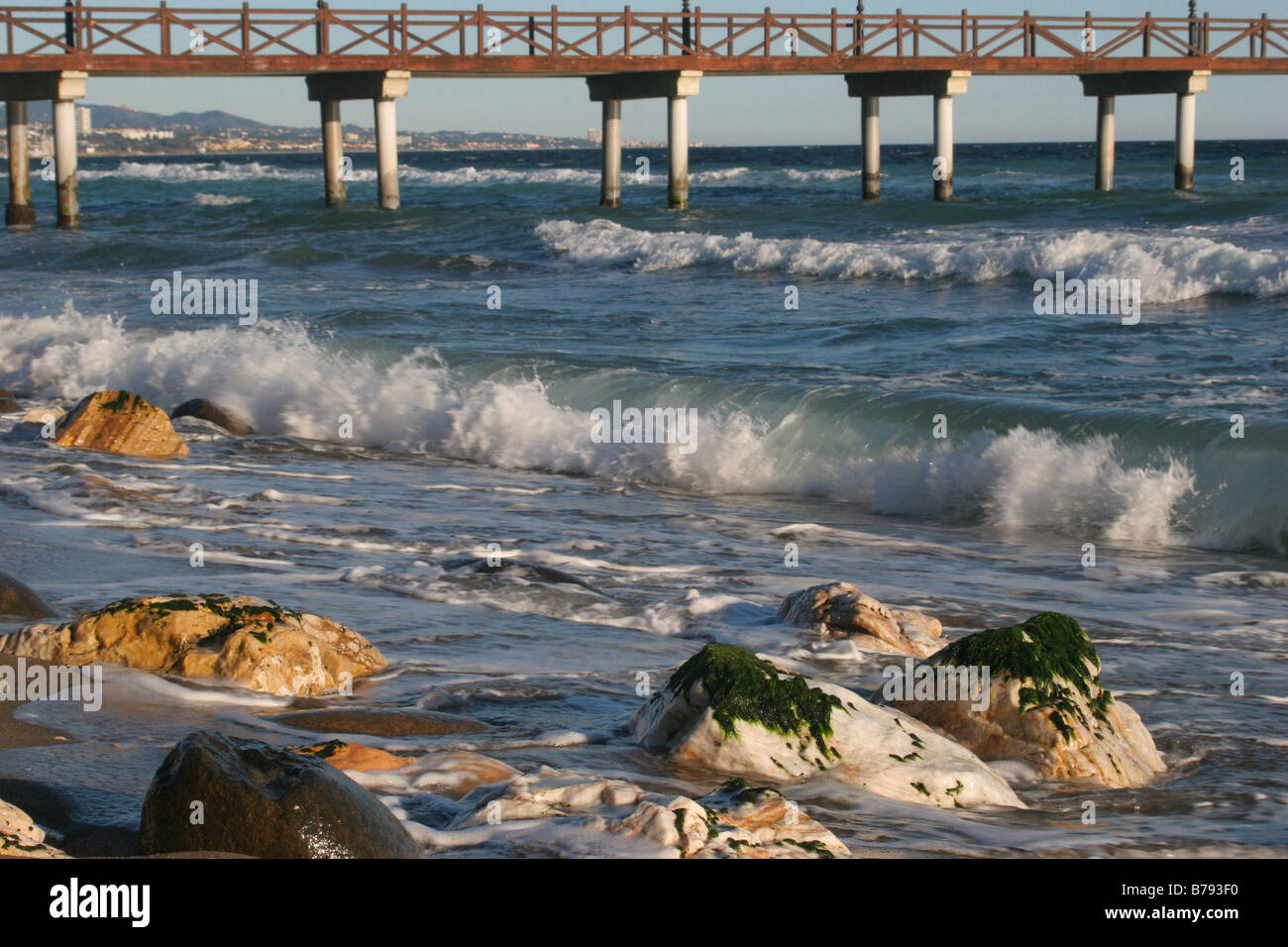 A jetty on the shore of Marbella, Spain Stock Photo - Alamy