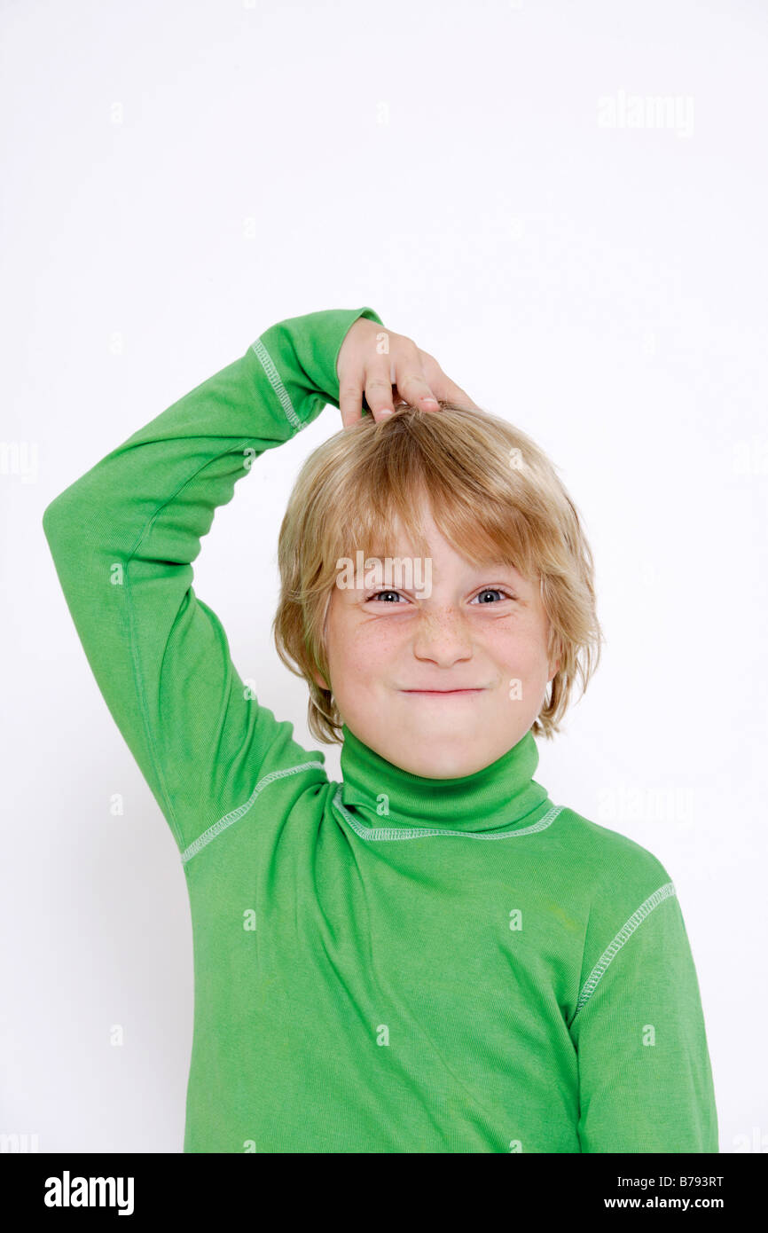 Little boy (10-11) pulling a face, portrait Stock Photo - Alamy