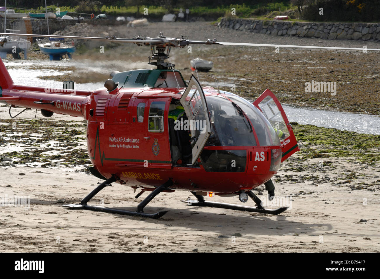 Wales Air Ambulance helicopter and crew rescuing a casualty at Solva ...