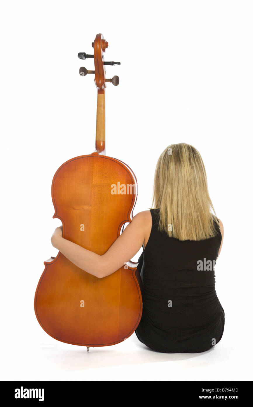 A woman with a cello musician sits with his back to camera Stock Photo ...