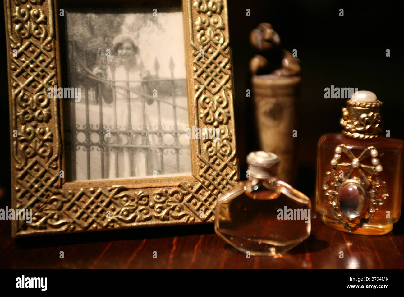 goldframe with picture of women, perfume bottles Stock Photo - Alamy