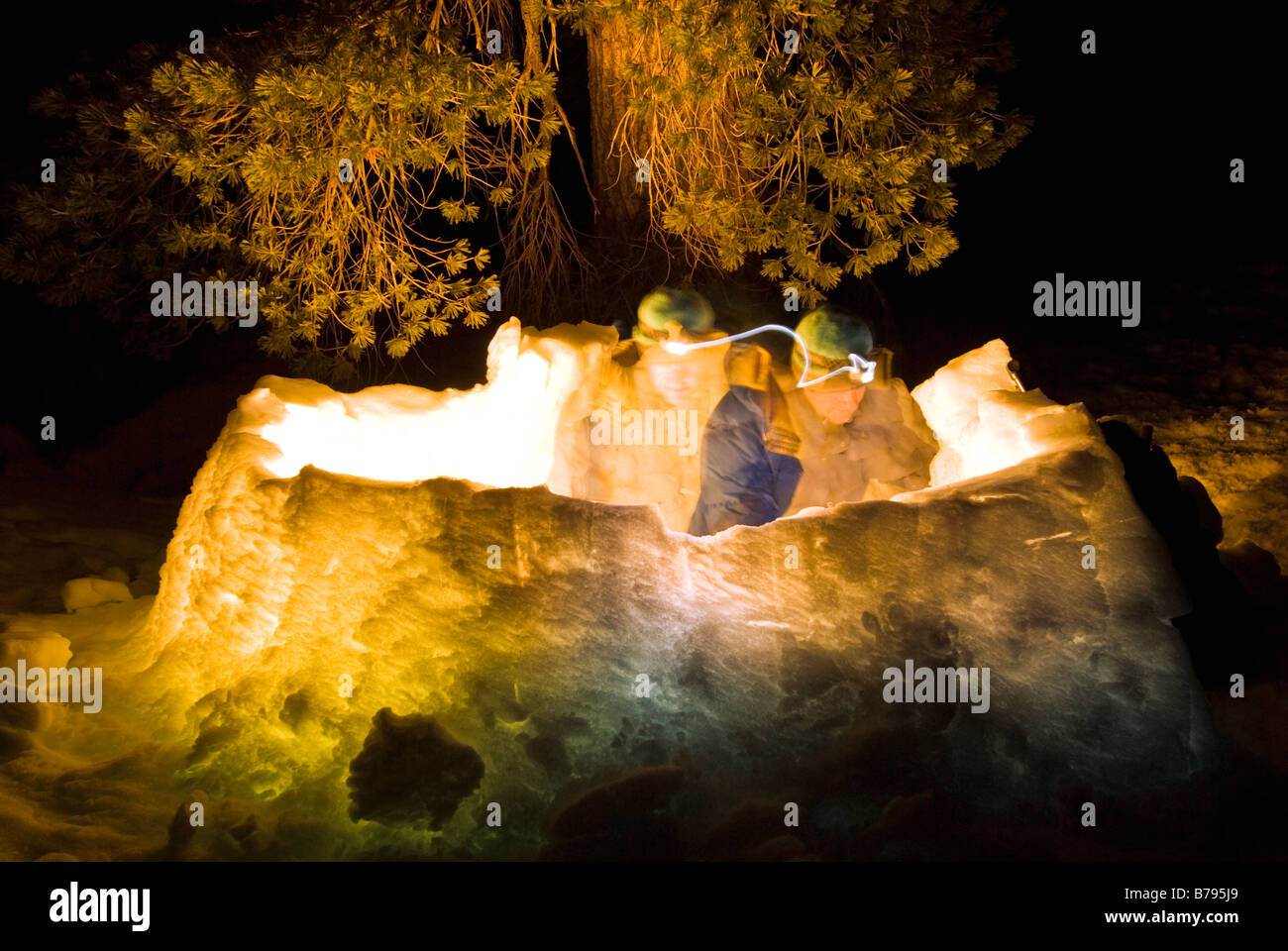 Backcountry skier in a snow kitchen at night Yosemite National Park ...