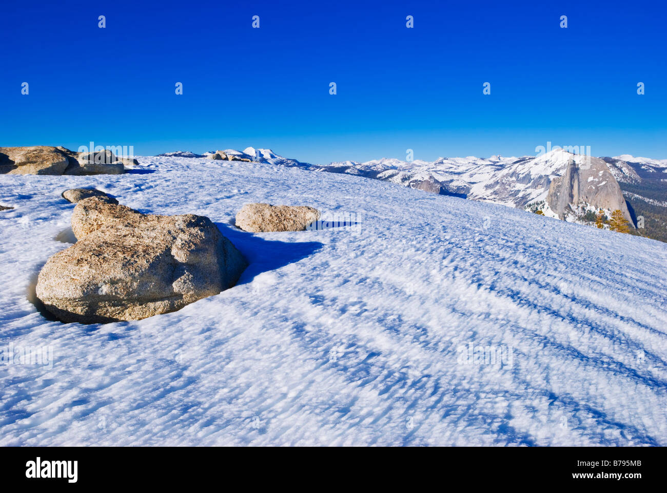 Half Dome and wind blown snow on the summit of Sentinel Dome Yosemite ...