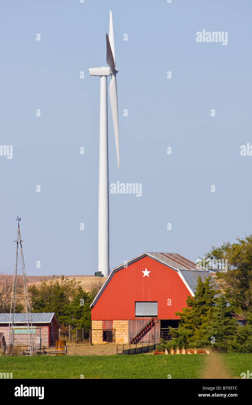 A large wind turbine stands next to a barn Stock Photo - Alamy