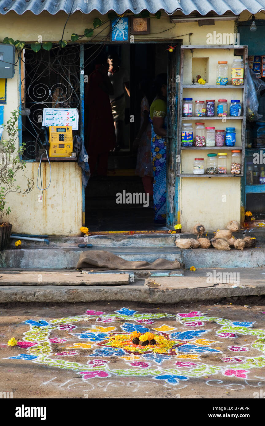 Rangoli design with flowers and cow dung used in an Indian street to ...