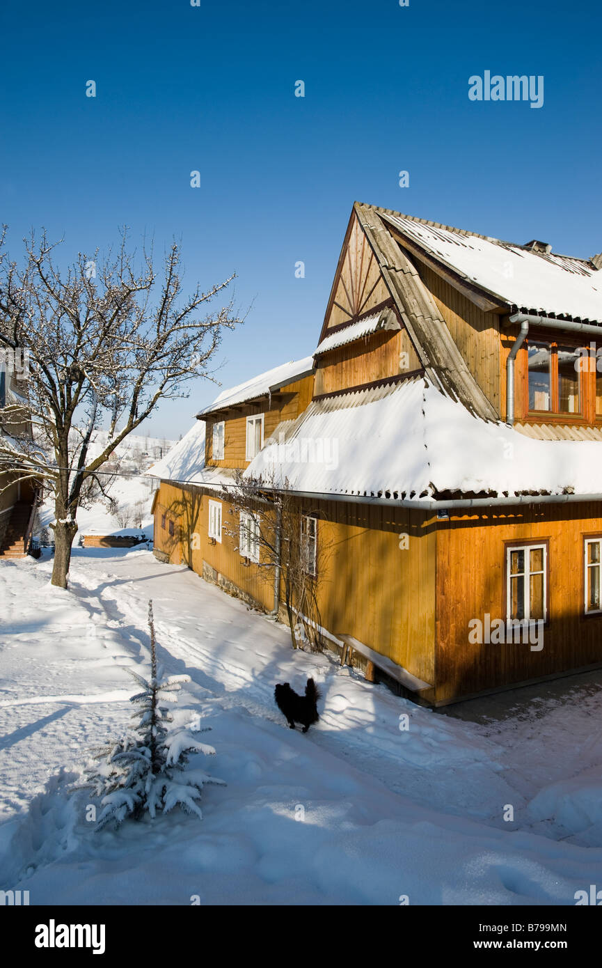 Snow covered village of Bukowina Tatrzanska and typical wooden ...
