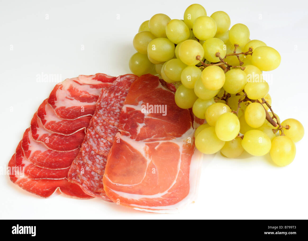 ham and salami slice with grape Stock Photo - Alamy