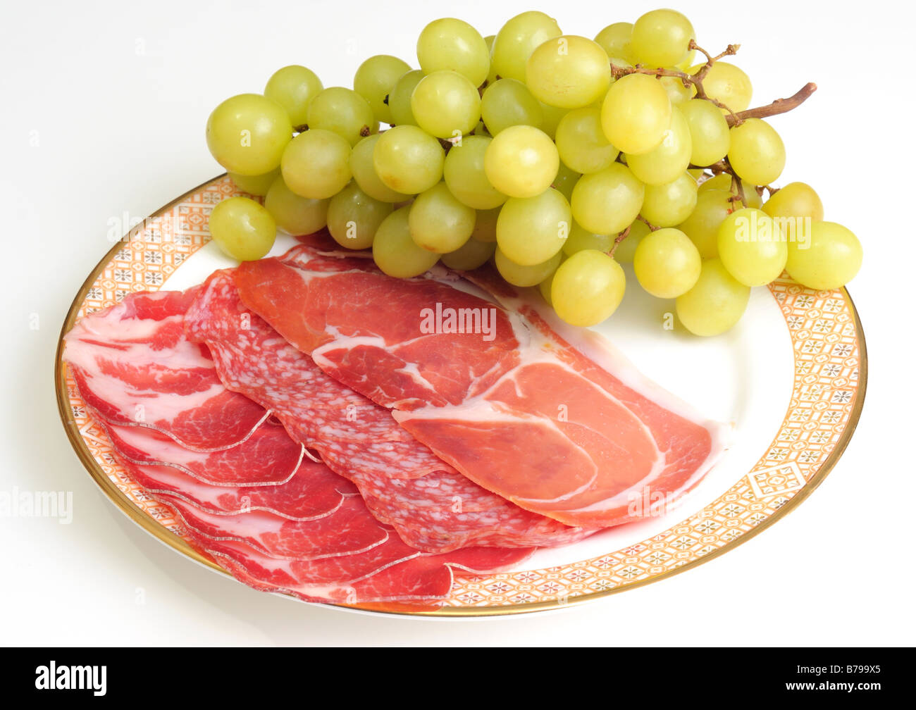 ham and salami slice with grape Stock Photo - Alamy