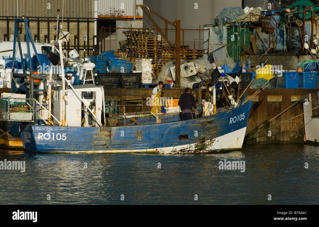 Commercial Fishermen Unloading Their Catch from their fishing boat At ...