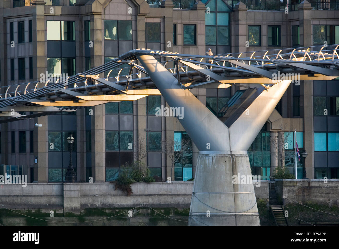 Man crossing Millennium Bridge London Stock Photo - Alamy