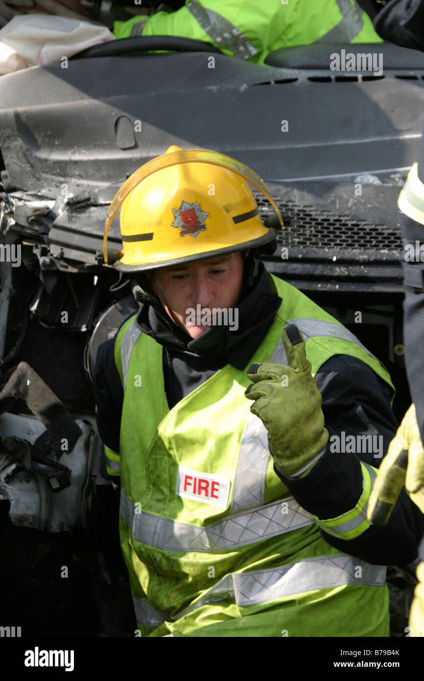 Fire Fighter at scene of road accident Stock Photo - Alamy