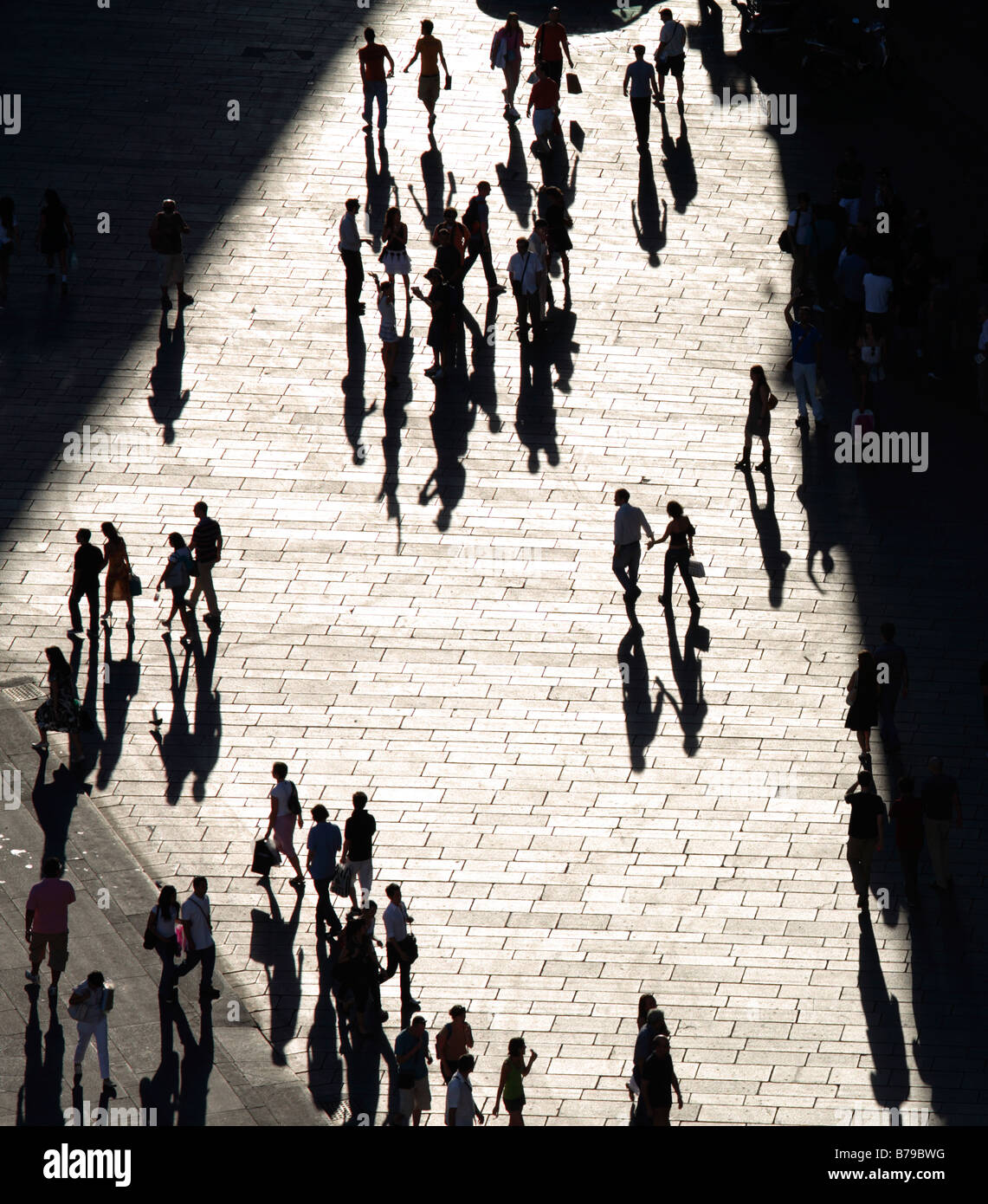 Silhouetted people in a public square Stock Photo - Alamy