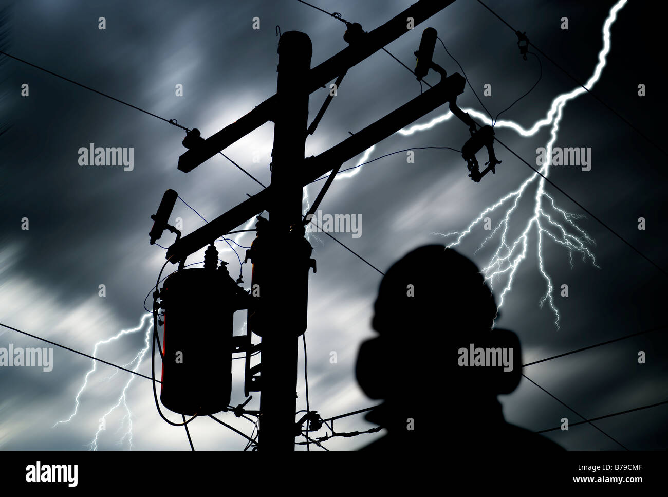 engineer checking power line during lightning storm Stock Photo - Alamy
