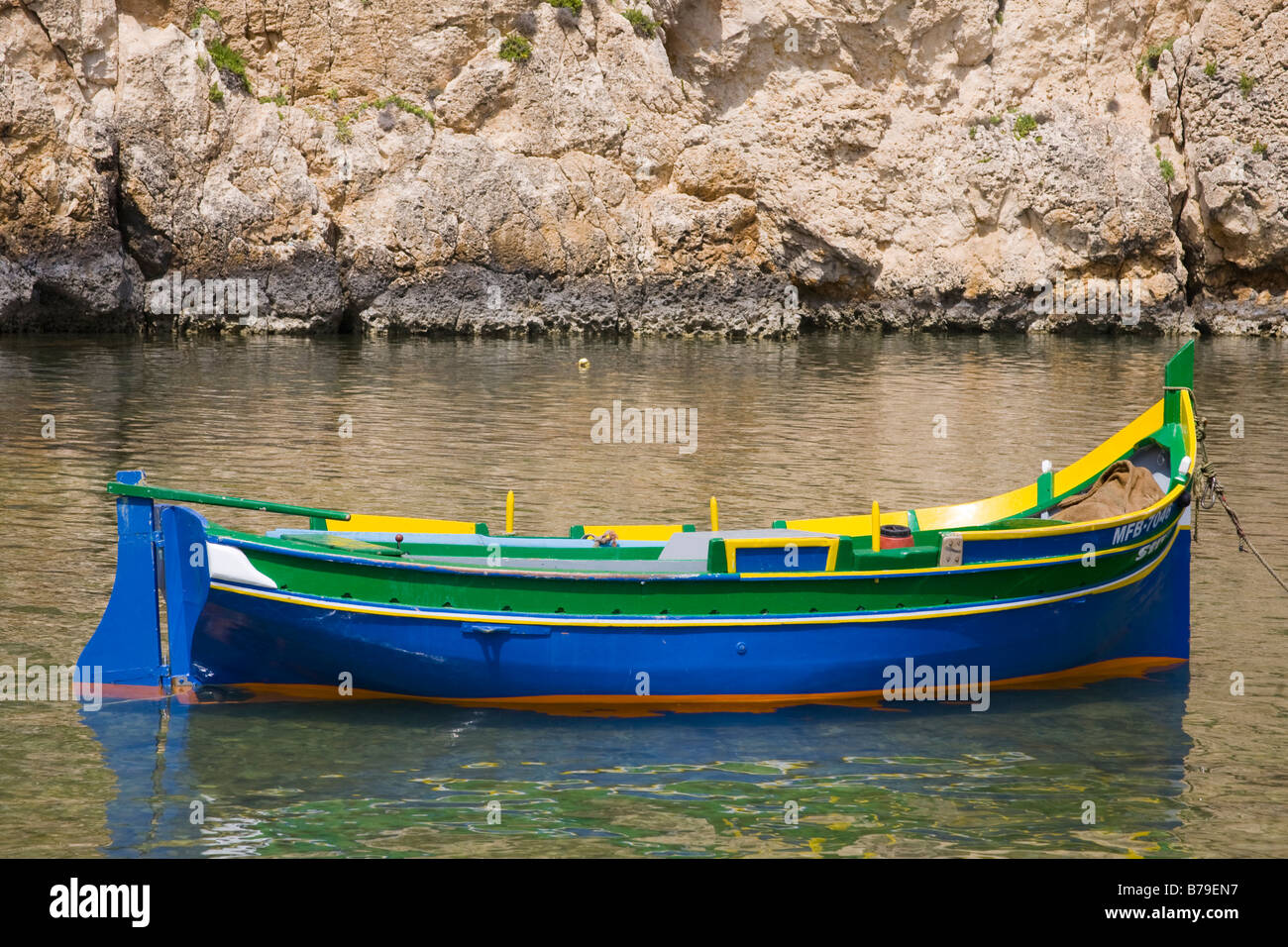 Luzzu fishing boat moored in the Inland Sea, Il-Qawra, Dwejra, Gozo ...