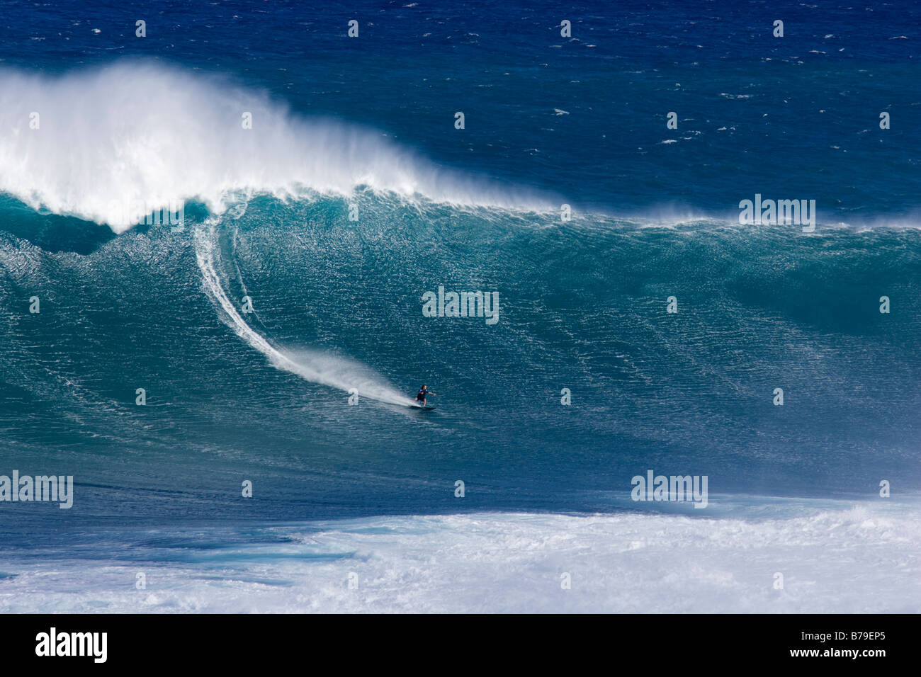 A surfer goes left at Jaws, Maui, Hawaii Stock Photo - Alamy