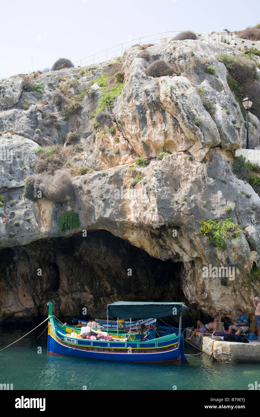 Luzzu fishing boat moored in Xlendi fishing village, Gozo, Malta Stock ...
