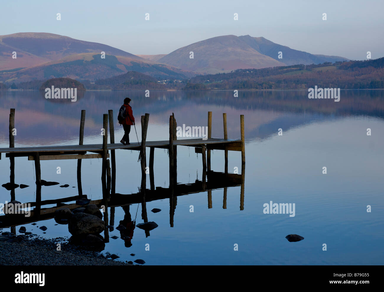 Woman lake jetty lake district hi-res stock photography and images - Alamy