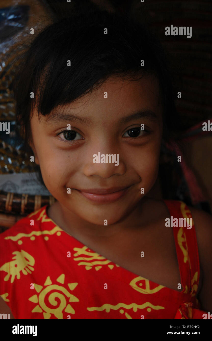 A young girl smiles for the camera in Ubud, Bali, Indonesia Stock Photo ...