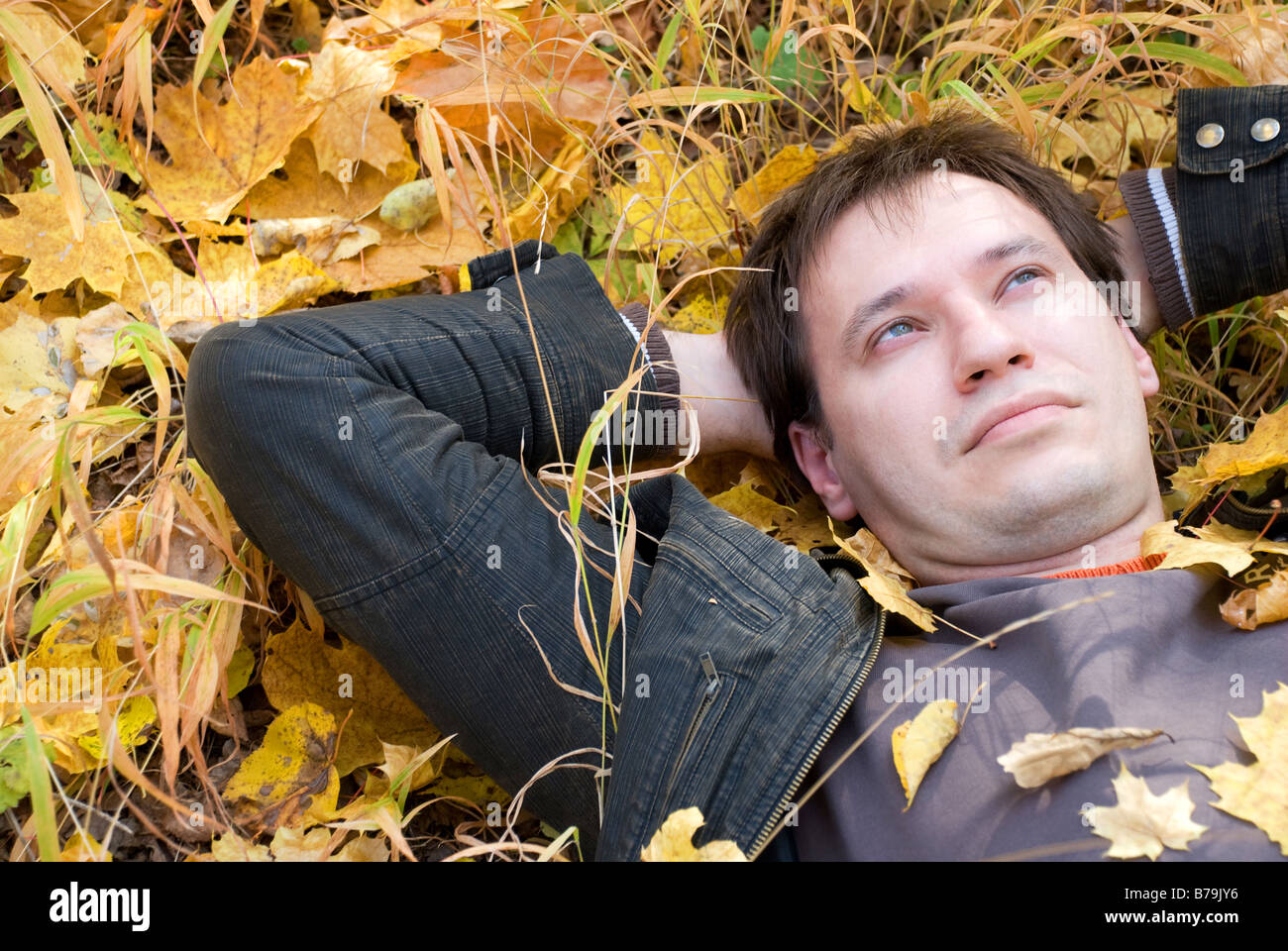Man walking on maple leaves hi-res stock photography and images - Alamy