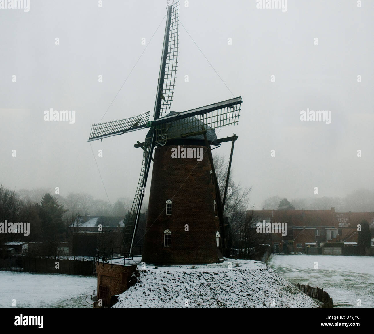 Snowed windmill in winter Stock Photo - Alamy