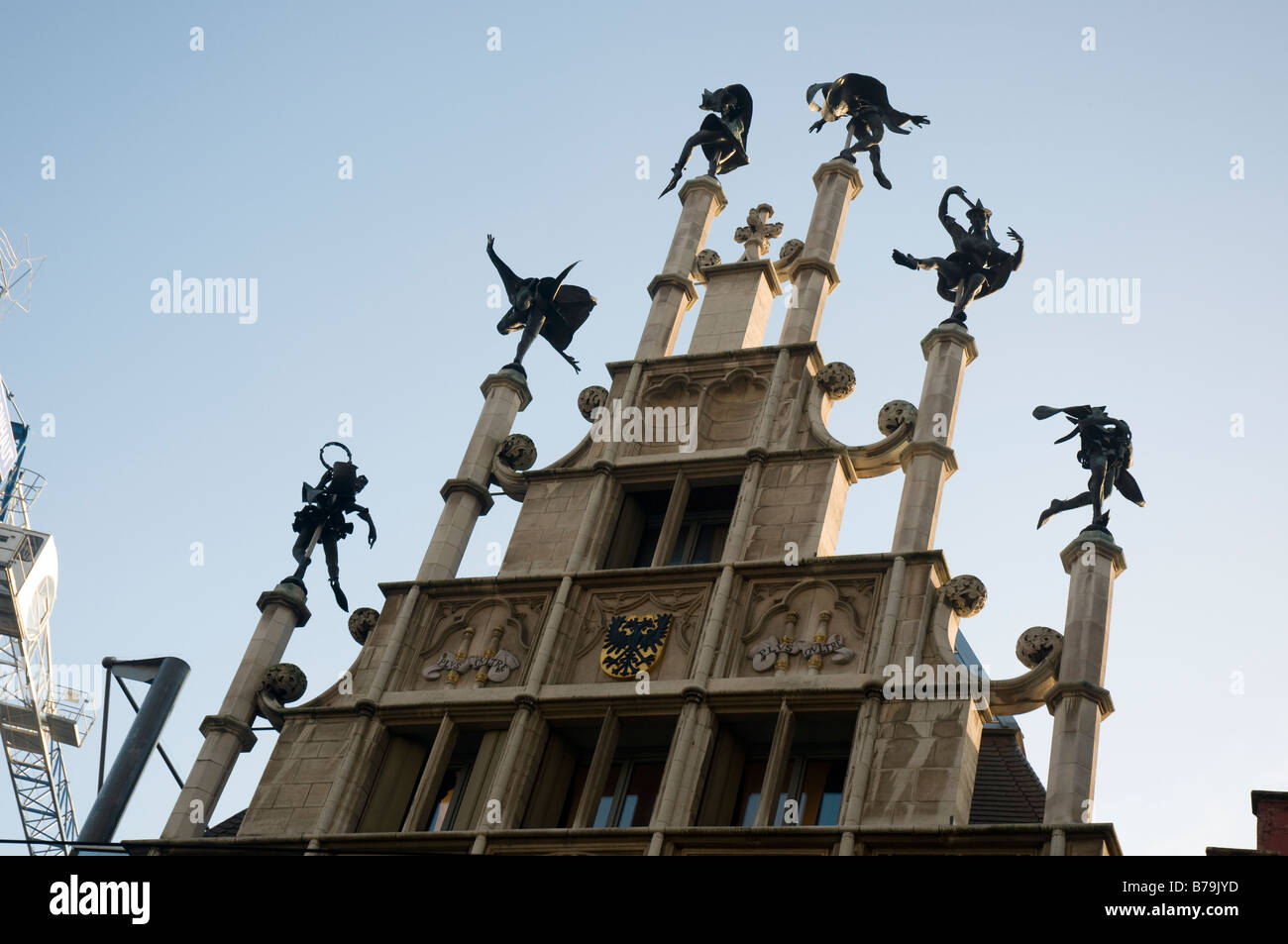 statues decorating a roof in an old house in Ghent Stock Photo - Alamy