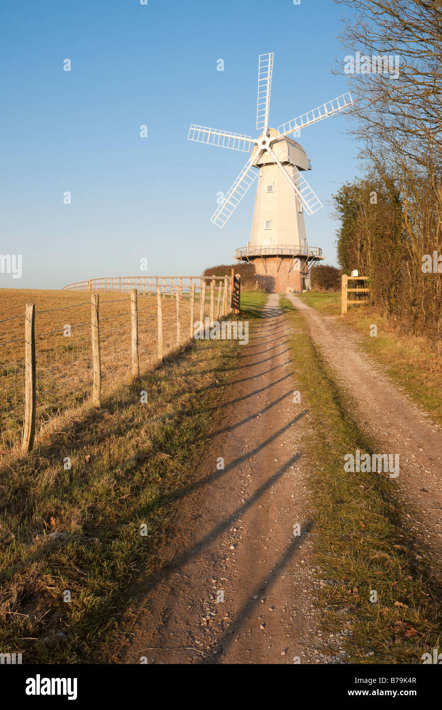 Old windmill with path and fence against clear blue sky Stock Photo - Alamy