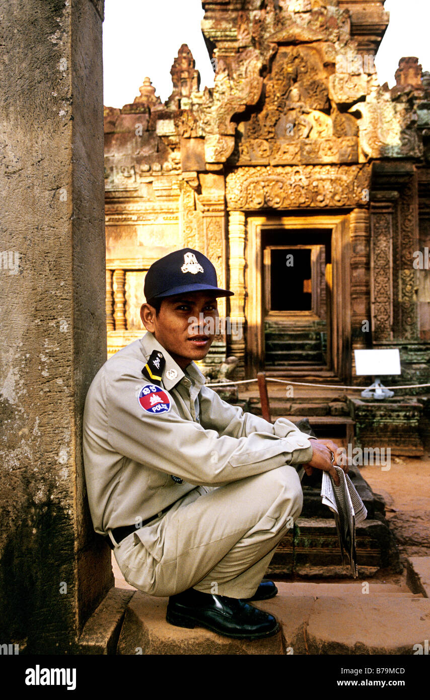 Security guard at the 10th century temple of Banteay Srei- Angkor Wat ...