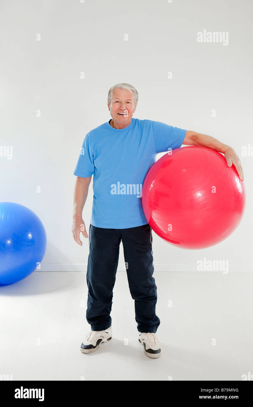 senior adult exercising with fitness ball in gym Stock Photo - Alamy