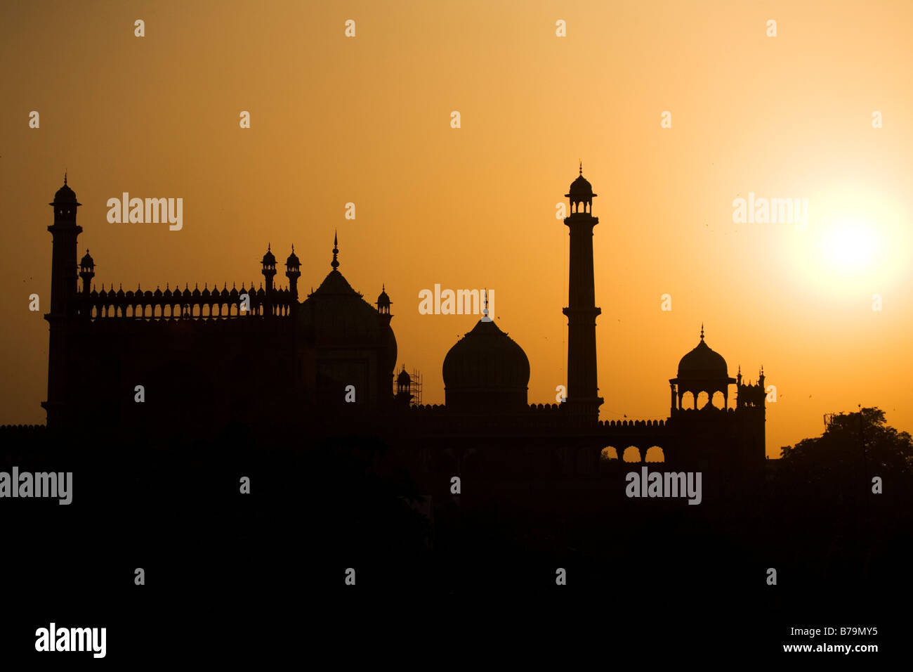 Sunset over the Jama Masjid in Delhi, India. The Jama Masjid is the ...