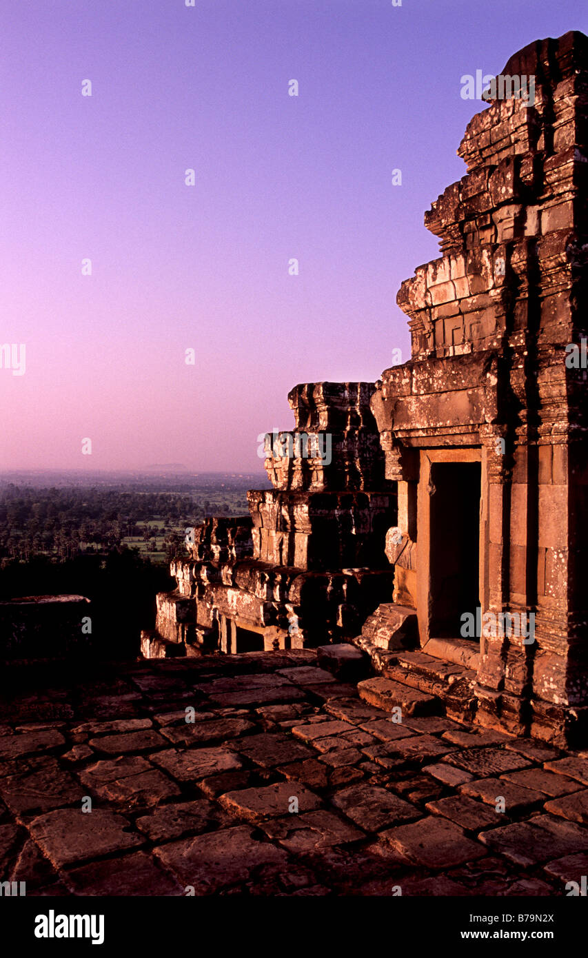 Sunset over 9th century Hindu temple of Phnom Bakheng. Angkor Wat ruins ...