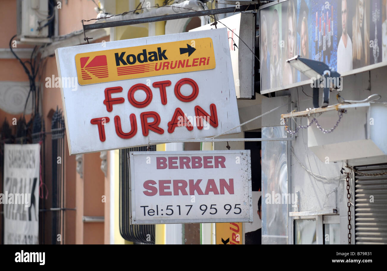 Commercial signs for a photography shop and a barber in Eminonu ...