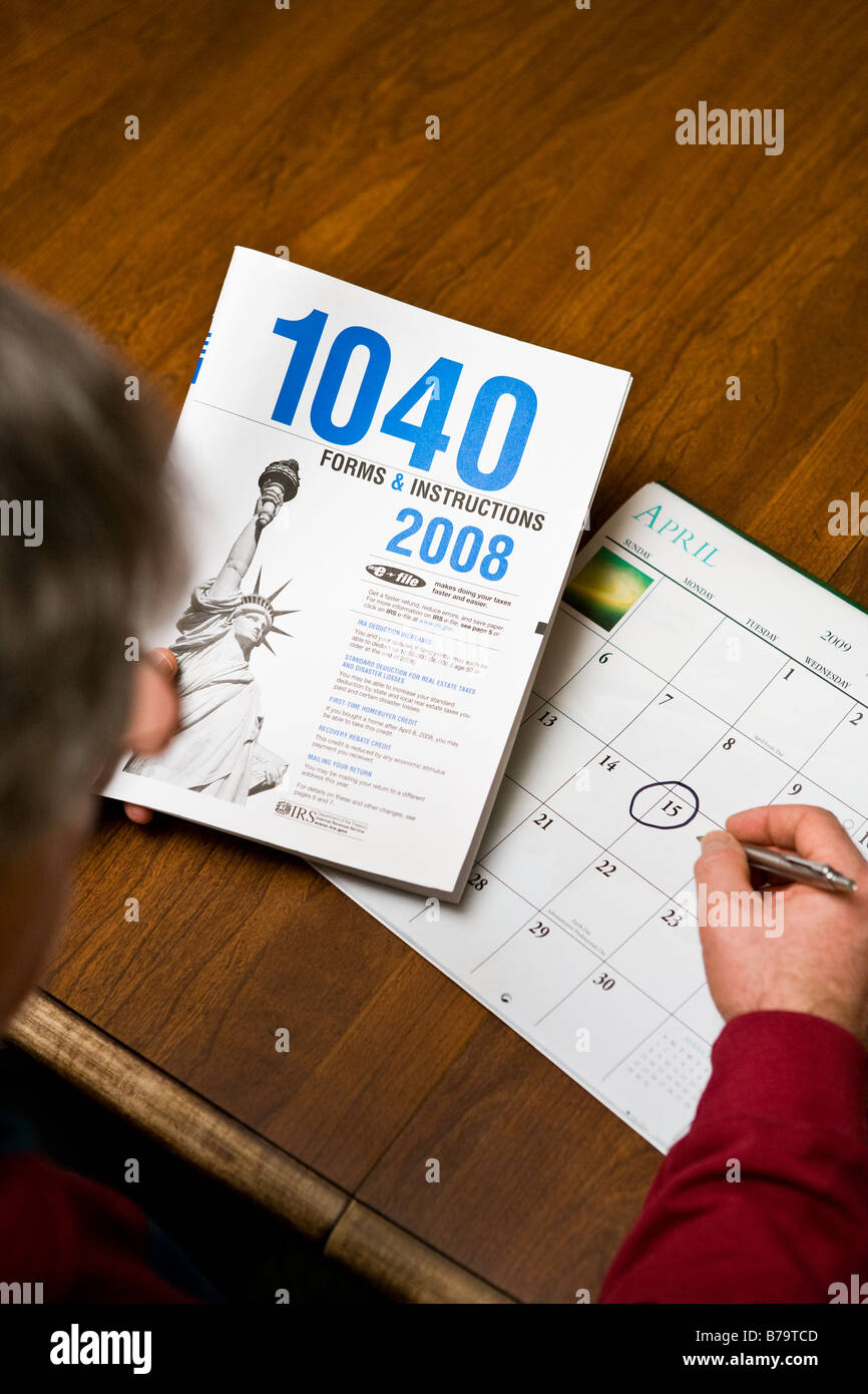 A man preparing to do his taxes Stock Photo - Alamy