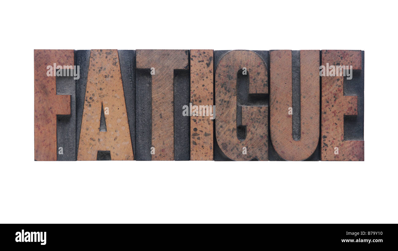 the word 'fatigue' in old ink-stained wood type Stock Photo - Alamy