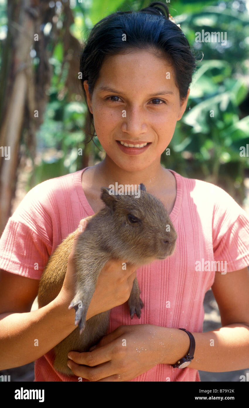 girl with hamster in village near iquitos Loreto Maynas Province amazon ...