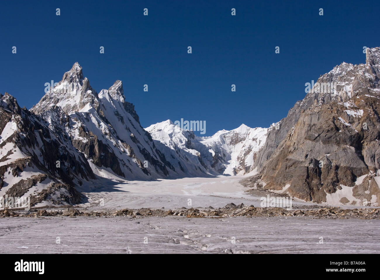 Granite mountain spires with snow on the Biafo glacier in the Karakoram ...