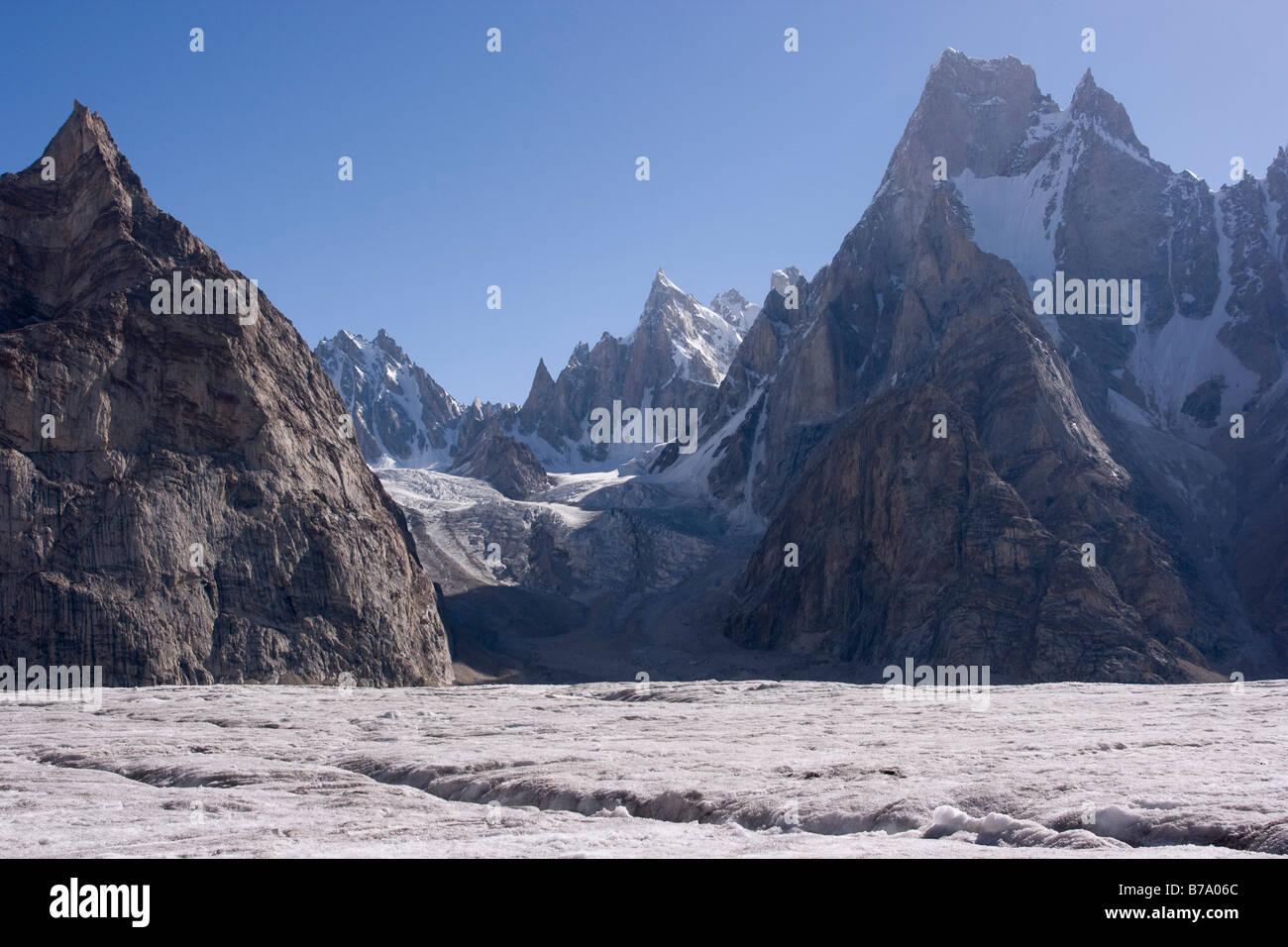 Granite mountain spires with snow on the Biafo glacier in the Karakoram ...