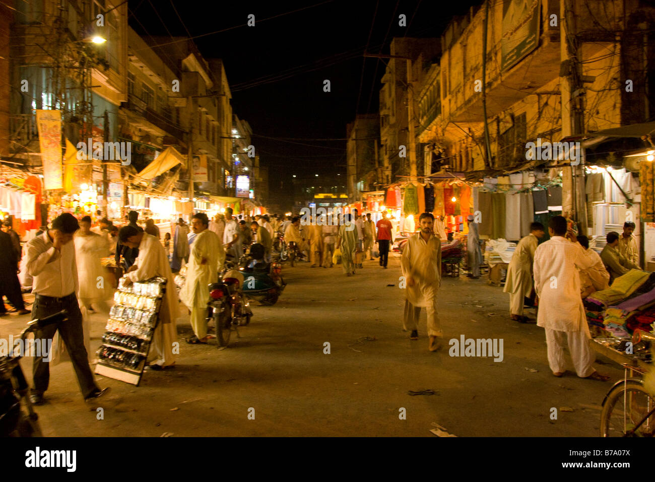 Crowds of people at night in the old bazaar in Rawalpindi Pakistan ...