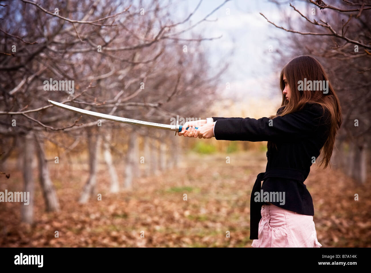 Portrait young woman sword forest hi-res stock photography and images ...