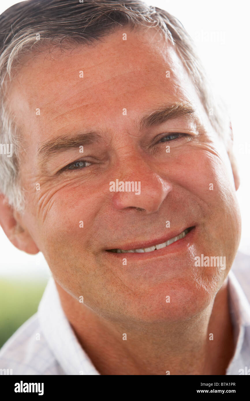 Portrait Of Middle Aged Man Smiling At The Camera Stock Photo - Alamy