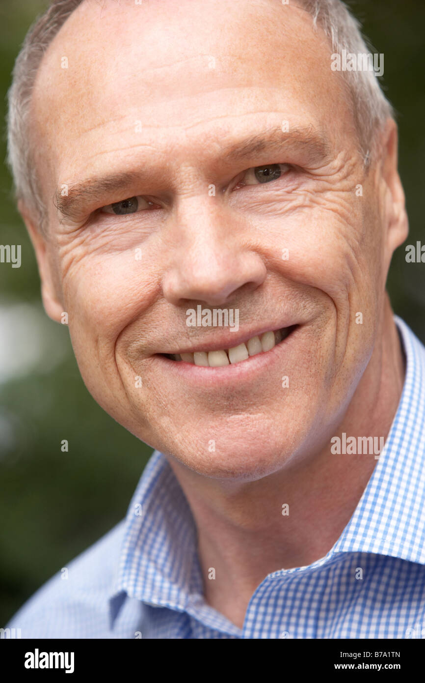Portrait Of Middle Aged Man Smiling At The Camera Stock Photo - Alamy