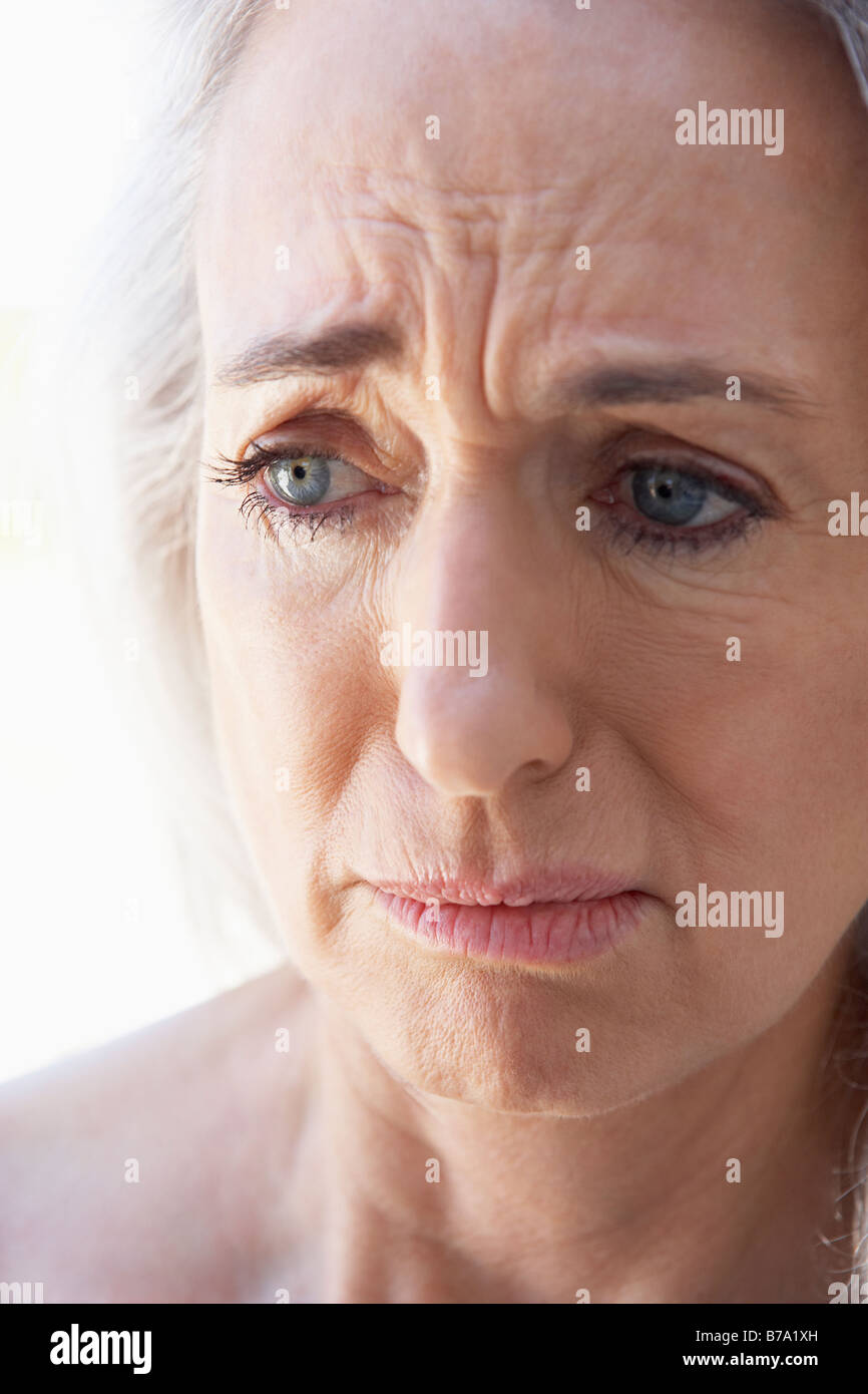 Old woman face anxious hi-res stock photography and images - Alamy