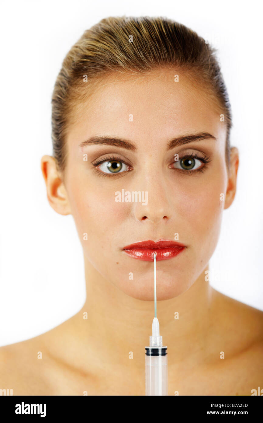 Young woman getting an injection for fuller lips Stock Photo - Alamy