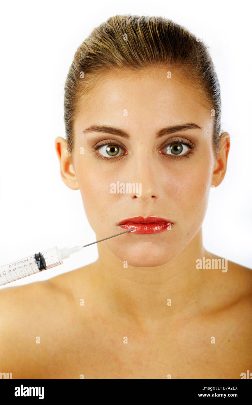 Young woman getting an injection for fuller lips Stock Photo - Alamy