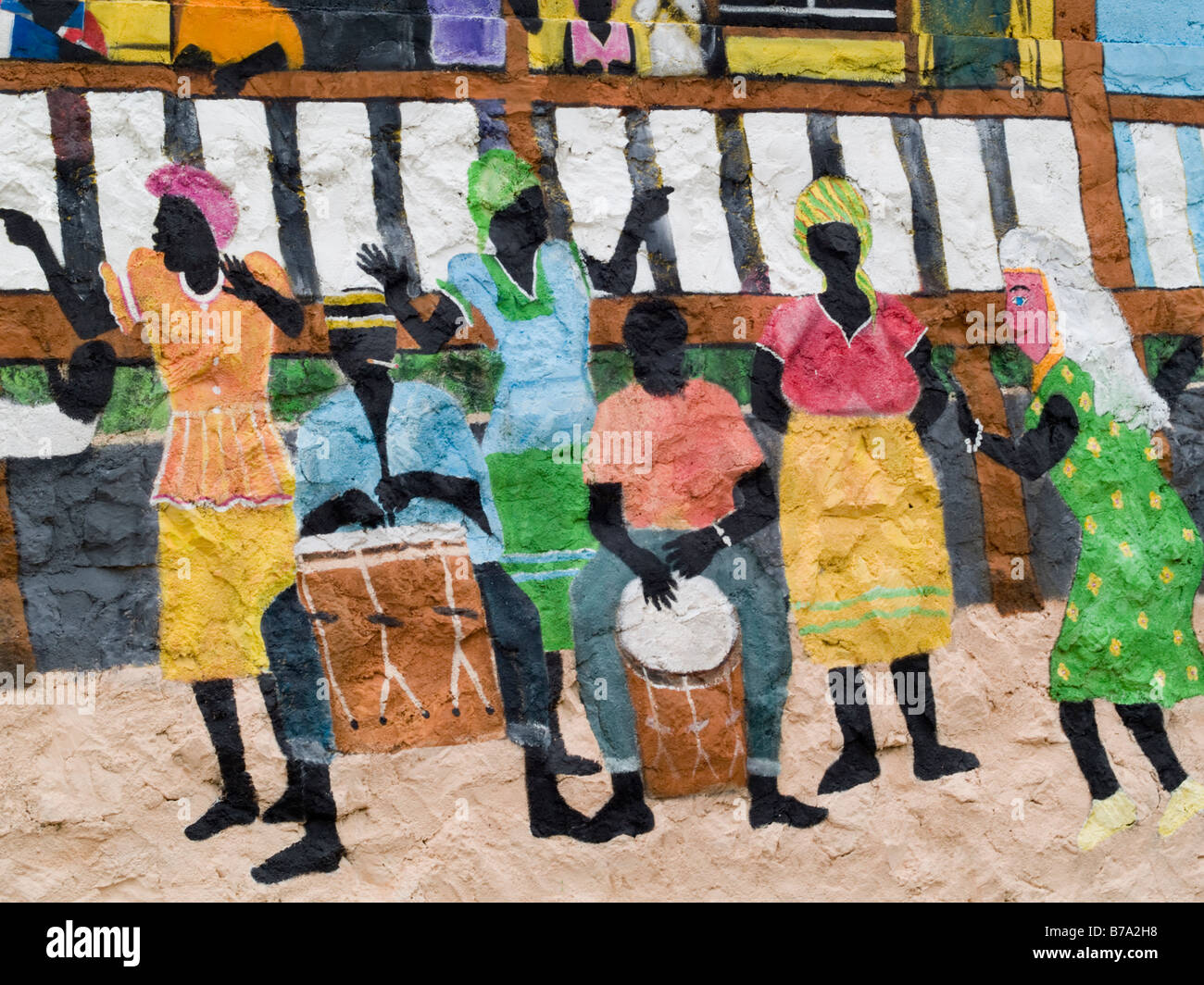 A Mural depicting a Garifuna drummers and dancers painted on a wall ...