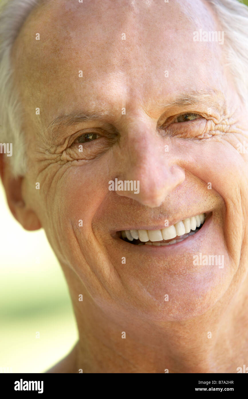 Portrait Of Senior Man Smiling At The Camera Stock Photo - Alamy