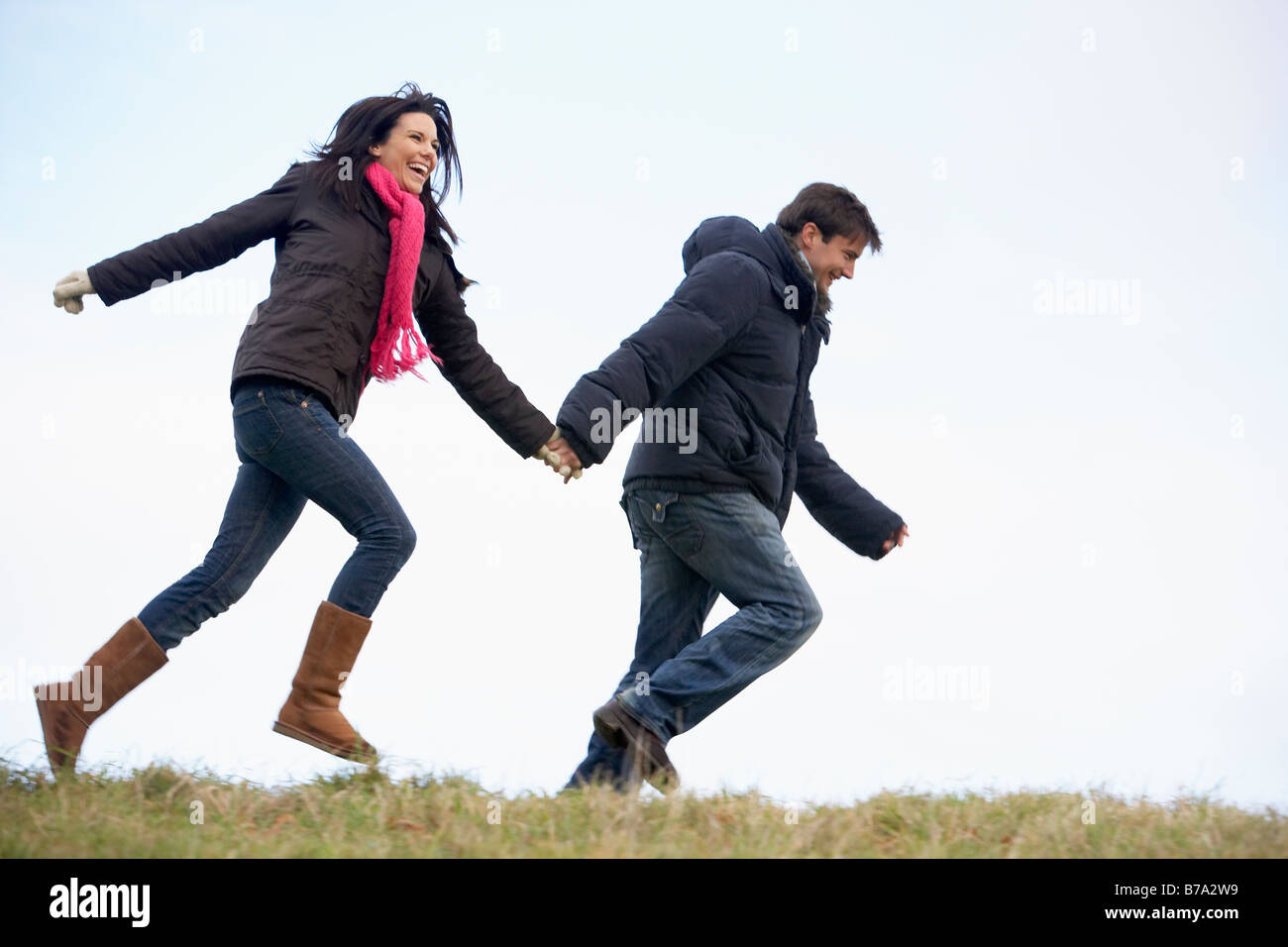 Running holding hands hi-res stock photography and images - Alamy