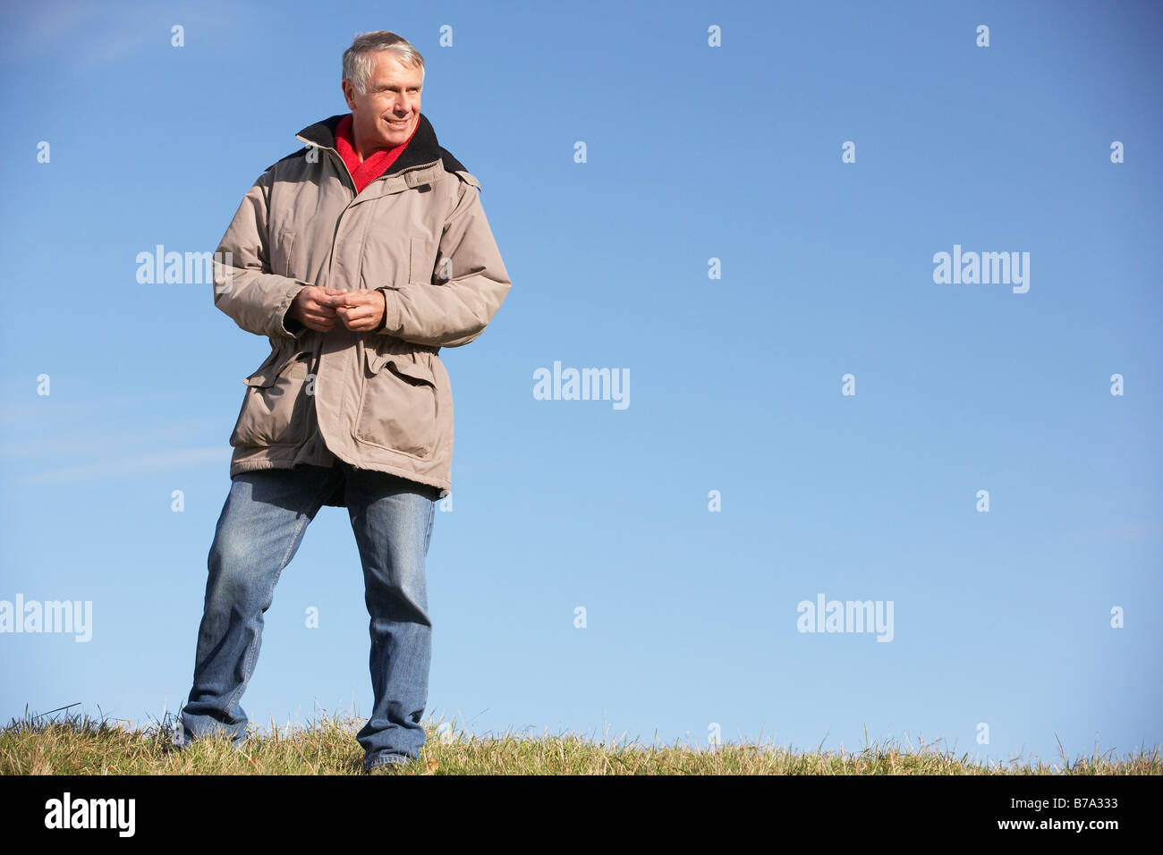 Senior Man Standing In Park Stock Photo - Alamy