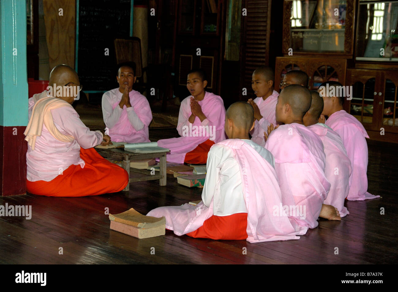 Novices sitting on the floor, being taught by a nun, nun convent ...