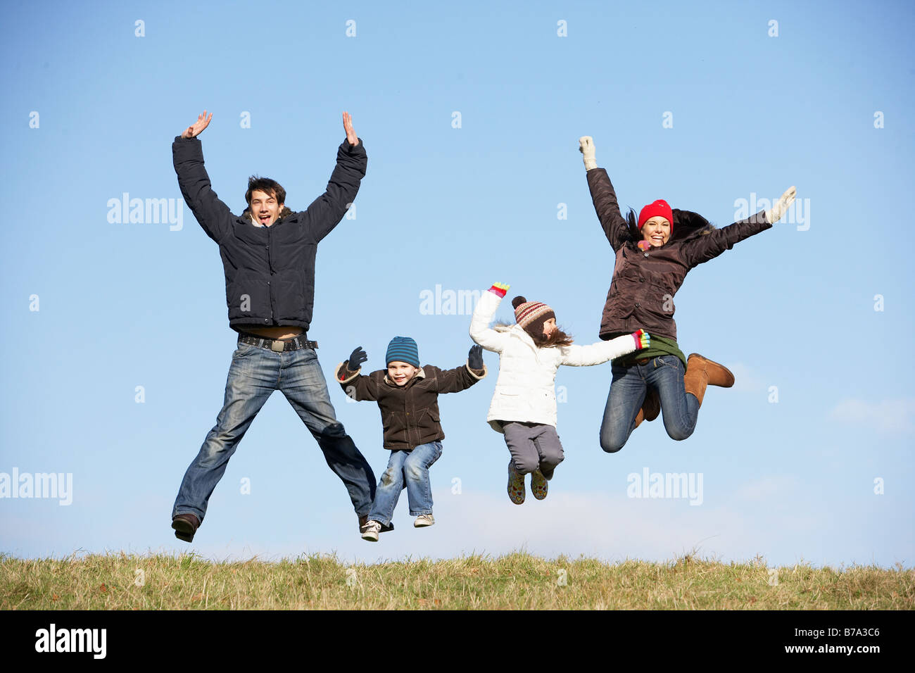 Family Jumping In The Air Stock Photo - Alamy