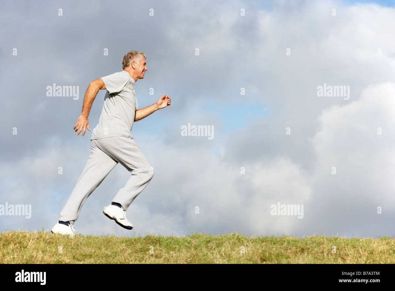 Senior Man Jogging In The Park Stock Photo - Alamy